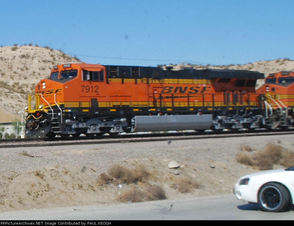 BNSF 7912 leads a vehicle train westbound.